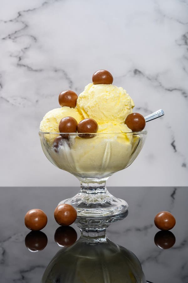 Bowl of Vanilla Flavor Ice Cream Sundae in a Melting Process with ...