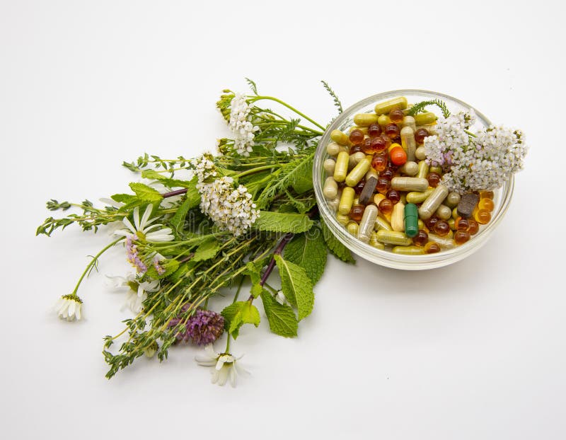 A Bowl with Various Capsules and Tablets, Medicinal and Aromatic Herbs ...