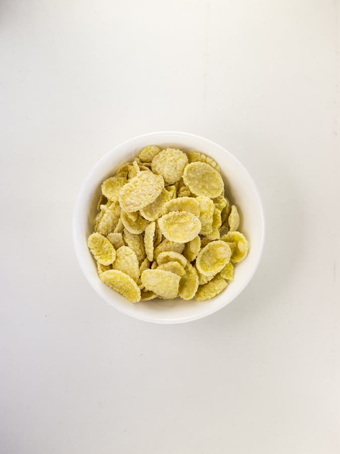 Bowl of Yellow Corn Flakes with on White Background Stock Photo - Image ...