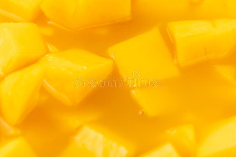 A Bowl of Yellow Fruit with Pieces of Fruit in it Stock Photo - Image ...