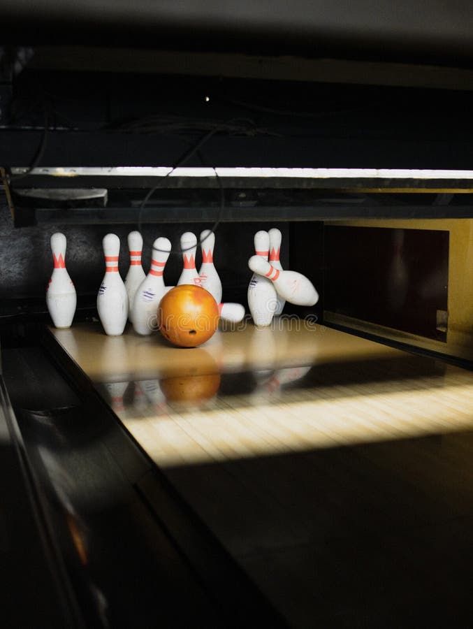Bowling ball striking pins stock image. Image of knocked - 254783131