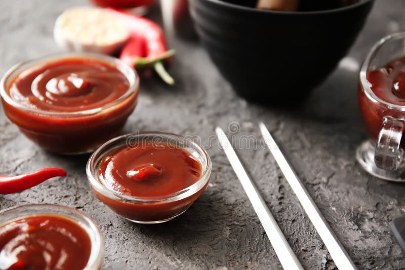 Bowls with Barbecue Sauce on Table Stock Image - Image of seasoning ...