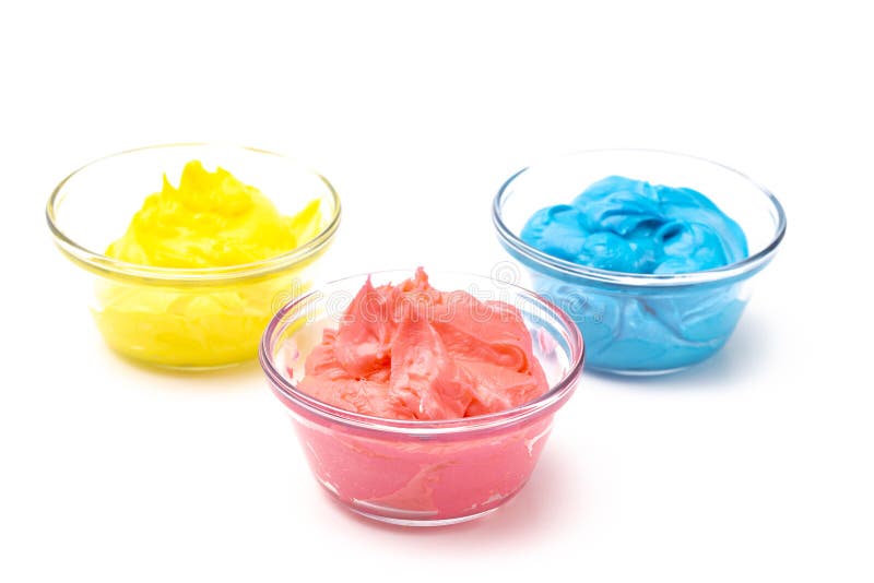 Bowls of Brightly Colored Icing Mixed Withed with Gel Food Coloring ...