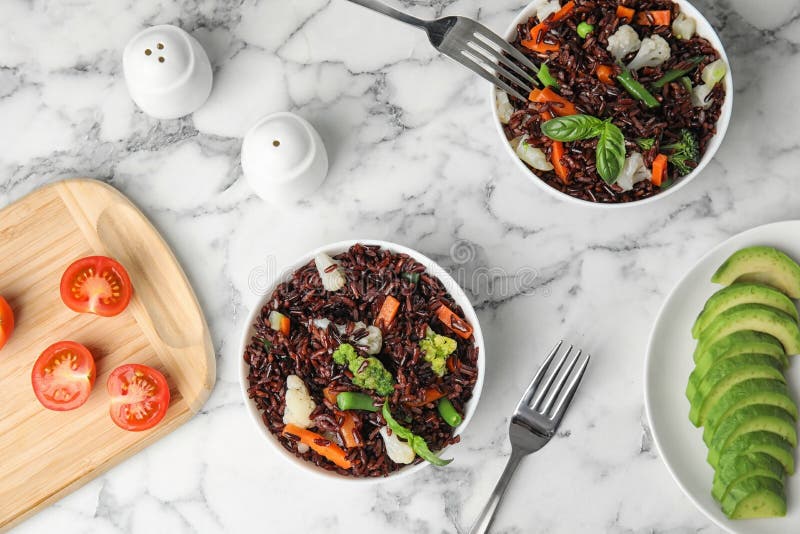 Bowls of Brown Rice with Vegetables on Marble Table Stock Image - Image ...