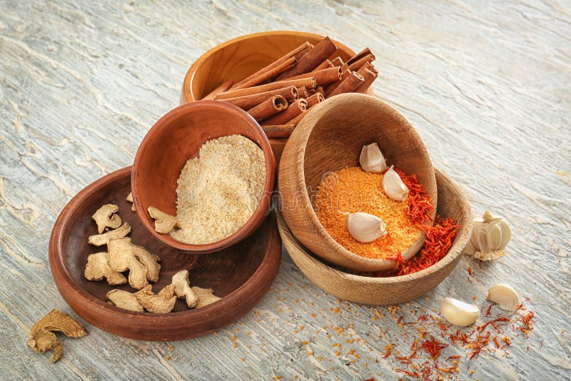 Bowls with Different Spices on Light Textured Background Stock Photo ...