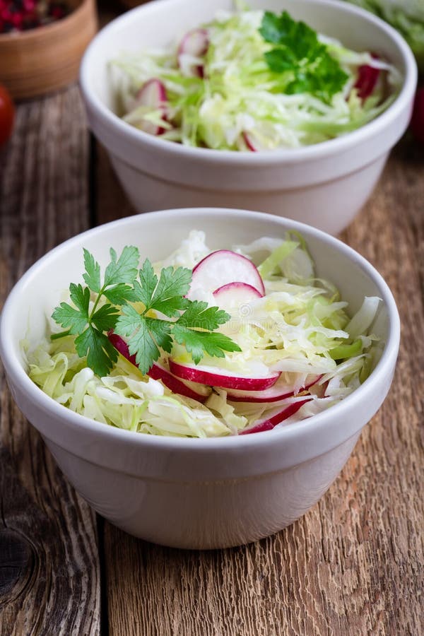 Bowls of Fresh Vegetable Salad with Cabbage and Radish Stock Photo ...
