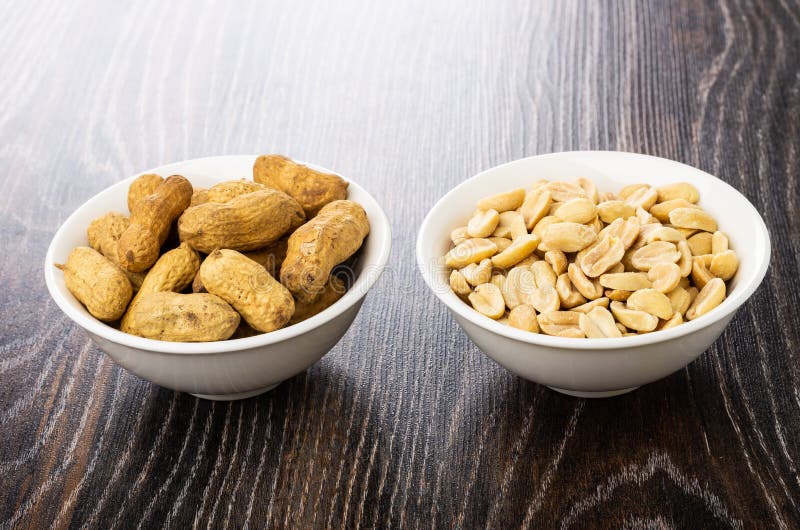 Bowls with Peanuts in Shell and Peeled Peanuts on Table Stock Image ...