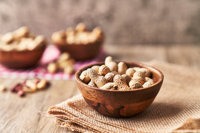 Bowls of Peanuts with Shell on a Wooden Surface Stock Photo - Image of ...