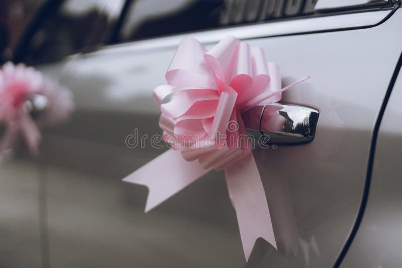 Bows Attached To the Handles of a Wedding Car Stock Photo - Image of ...