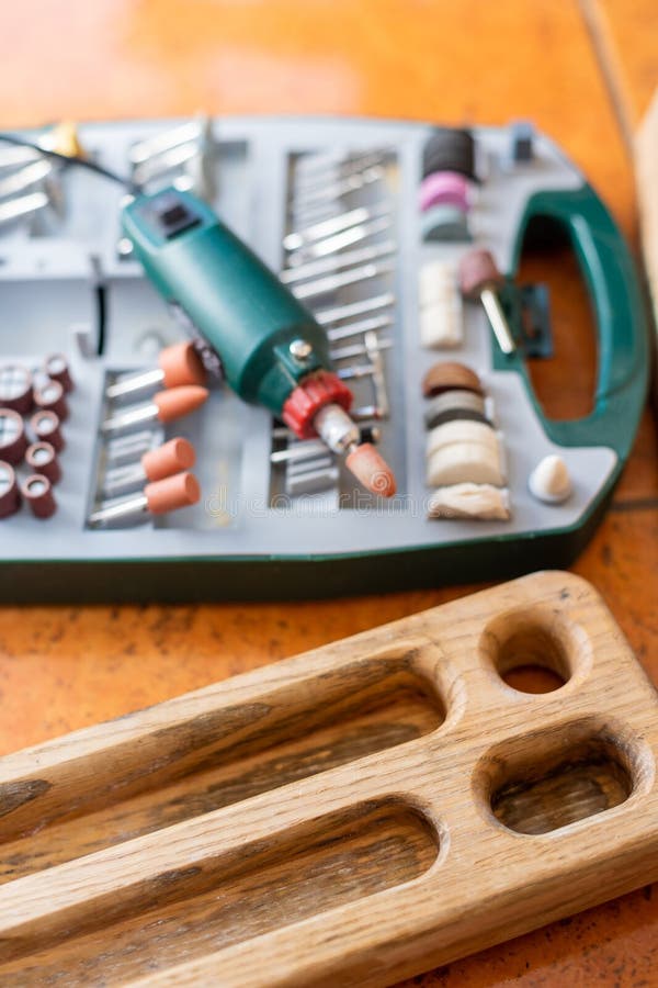 Box with Accessories for Processing and Engraving Next To an Electric ...