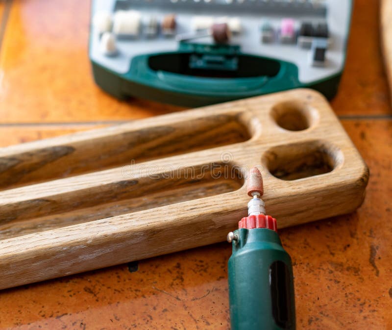 Box with Accessories for Processing and Engraving Next To an Electric ...