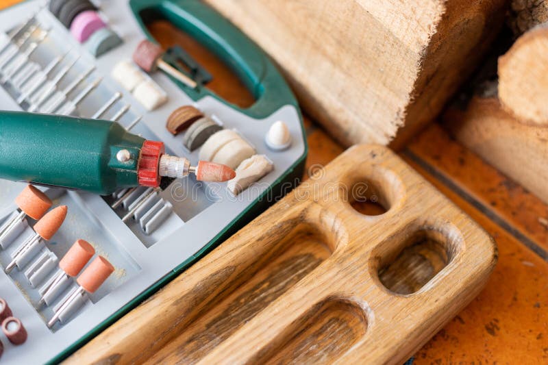 Box with Accessories for Processing and Engraving Next To an Electric ...