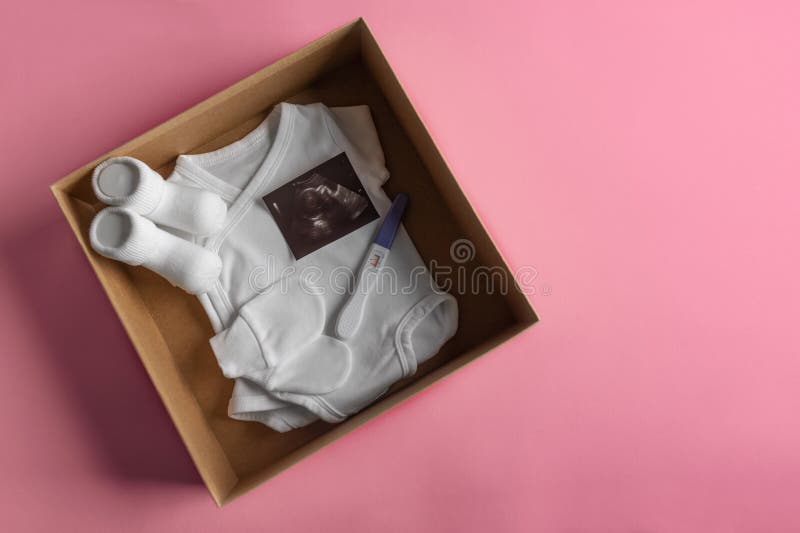 Box with Baby Stuff and Pregnancy Test. Stock Photo - Image of sell ...