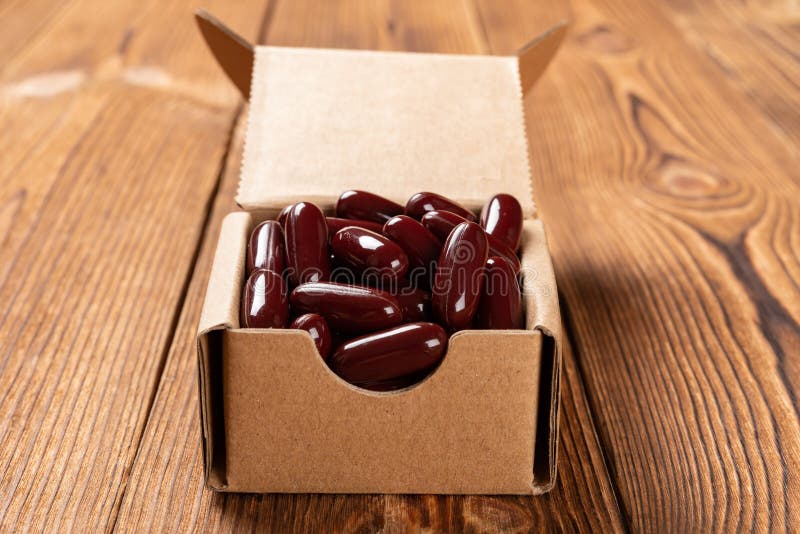 Box of Capsules on Wood Table Stock Photo - Image of pharmaceutical ...