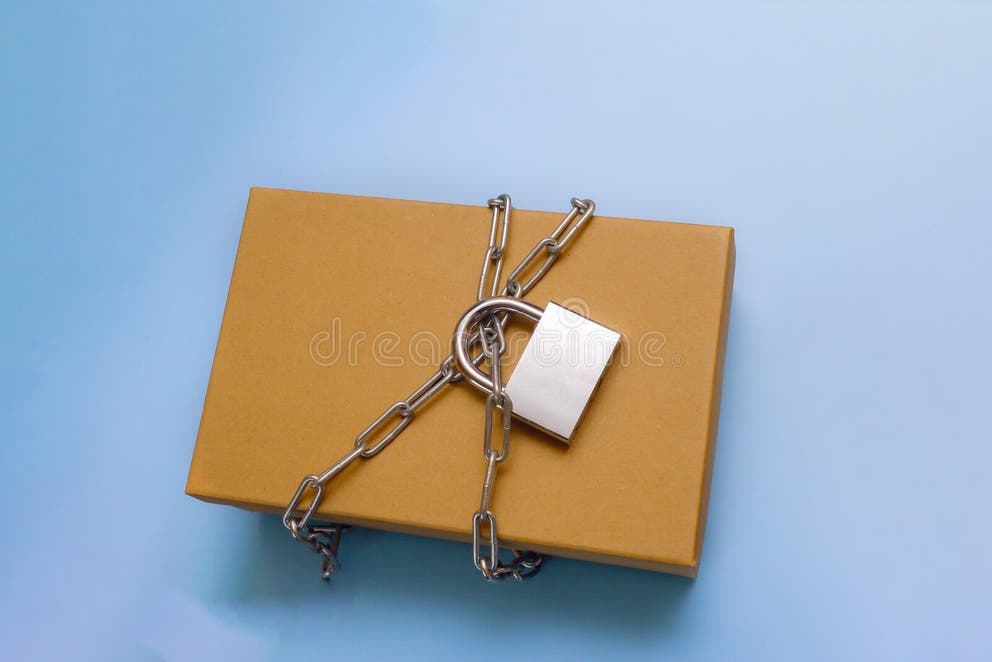 Box in Chains and Under Lock and Key on a Blue Background Stock Image ...