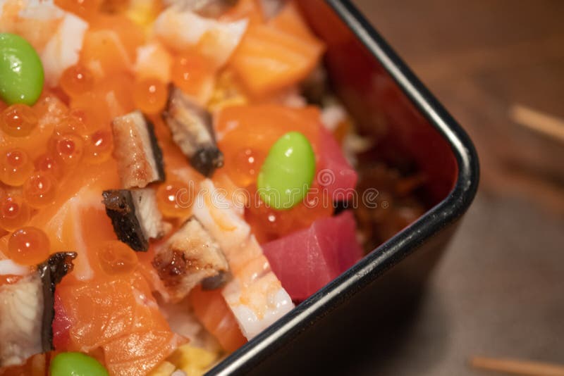 Box of Chirashi Sushi with Mixed Raw Fish and Salmon Roe Over Rice ...