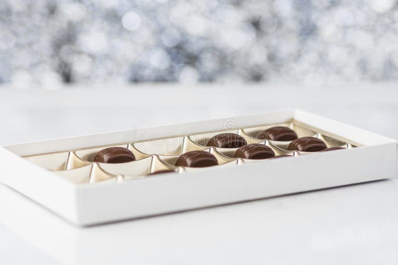 Box of Chocolates on Blurred Background Stock Image - Image of mixed ...
