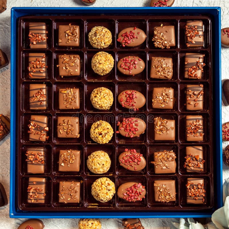 Box of chocolates top view stock photo. Image of addiction - 263160824