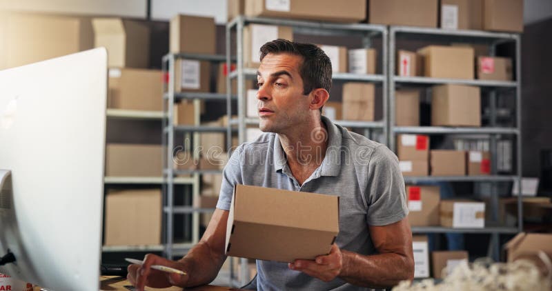 Box, Computer and Logistics with Man in Distribution Center for ...