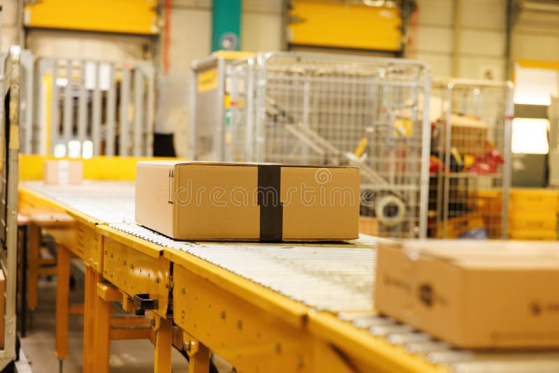 Box on Conveyor Roller. Delivery Service, Distribution Warehouse and ...