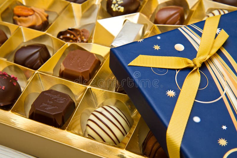 Box filled with chocolates stock photo. Image of dark - 67587844