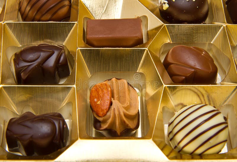 Box filled with chocolates stock photo. Image of dark - 65597006