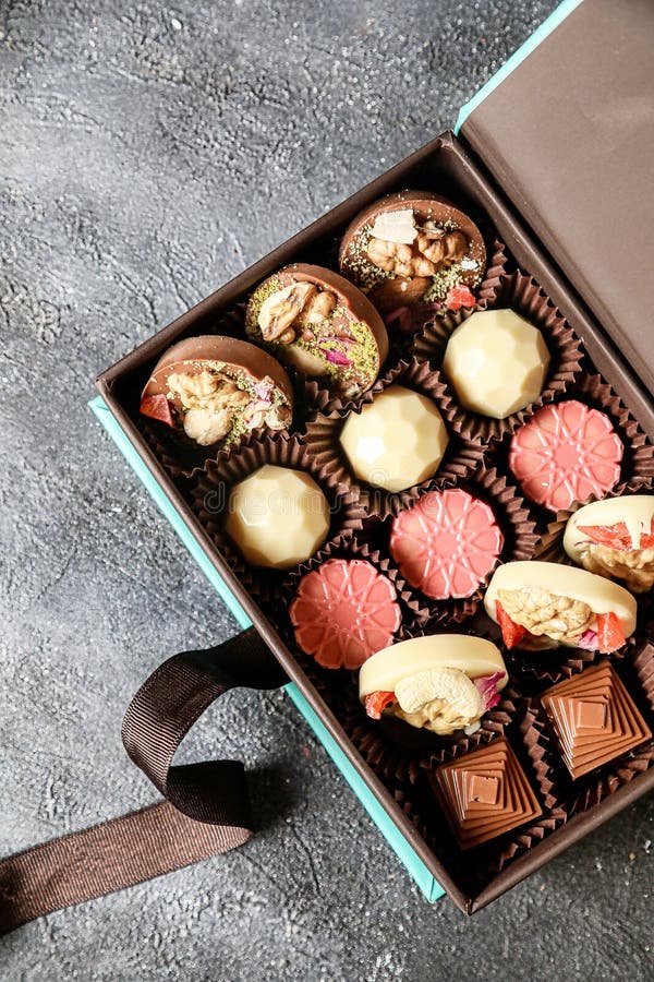 Assorted Chocolates Box Resting on Table Stock Image - Image of flavors ...