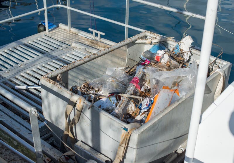 Box with Garbage on the Deck of a Special Vessel for Water Purification ...