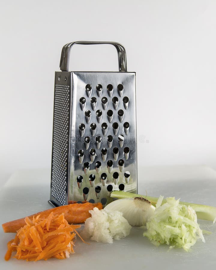 Box Grater with Onion Carrot and Celery Grated Stock Photo - Image of ...