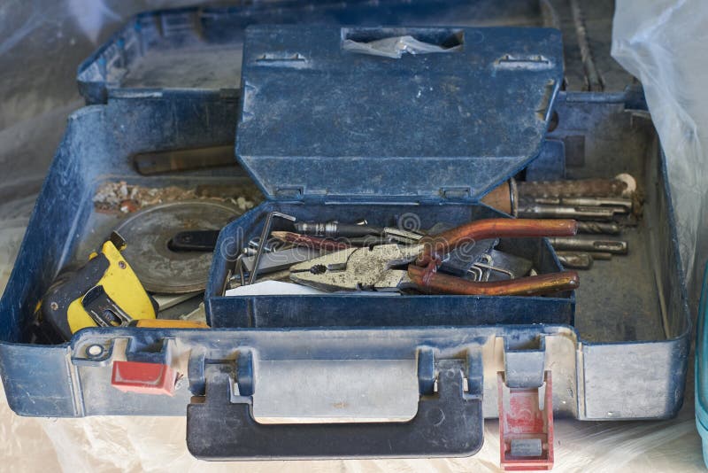 A Box with Old Tools Strewn with Construction Dust Stock Photo - Image ...