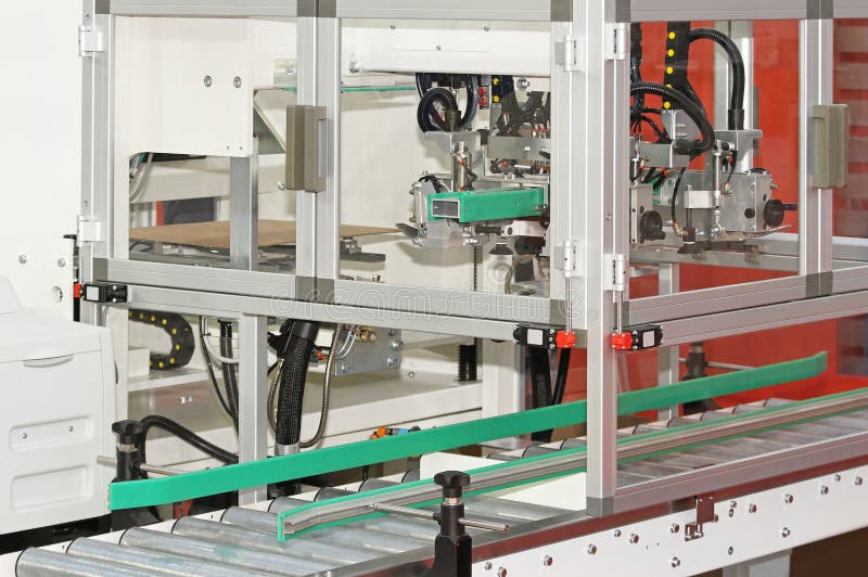 Box packing machine stock image. Image of conveyor, packaging - 44083183