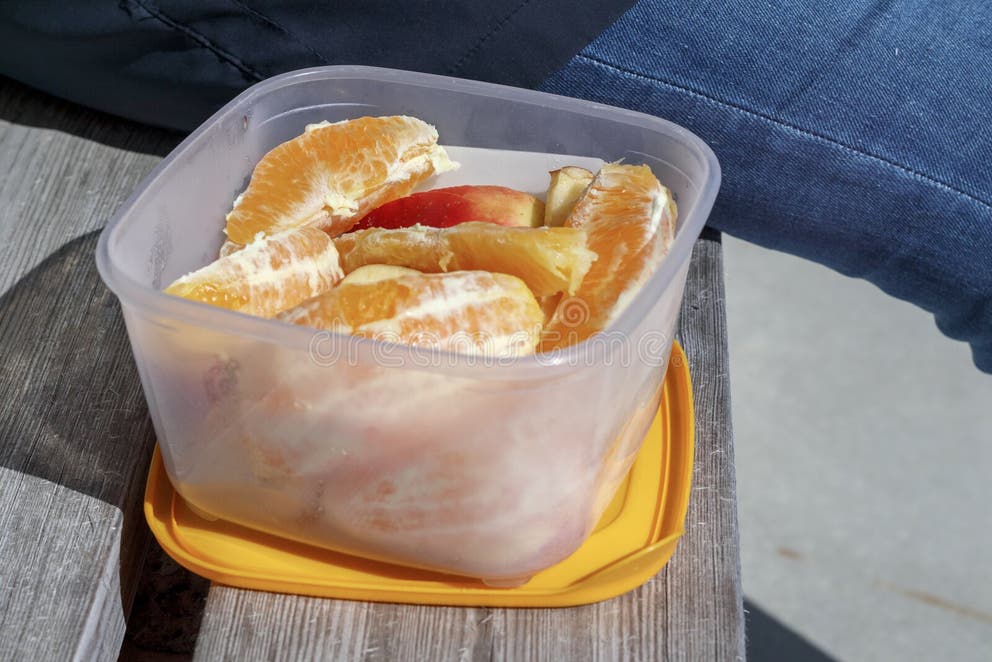 .a Box of Peeled Orange Slices and Apple Slices Stock Photo - Image of ...