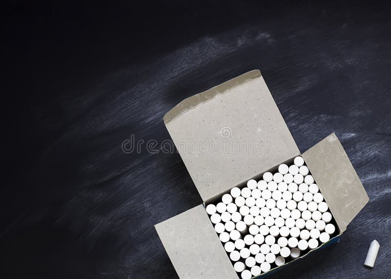 Box with Pieces of Chalk on a Blackboard Stock Image - Image of erase ...