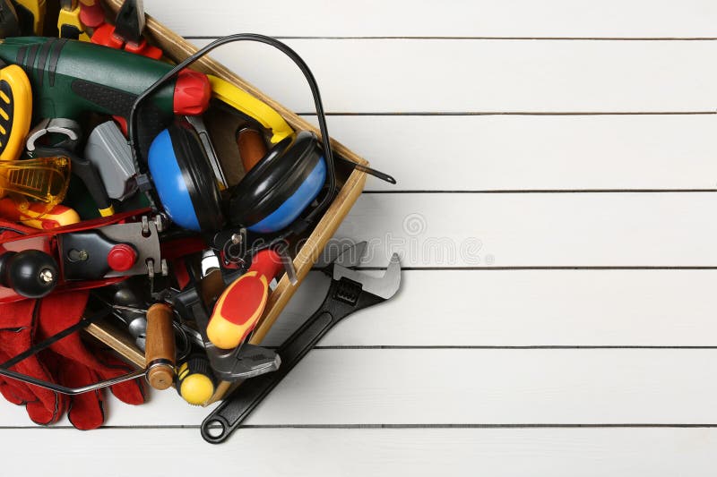 Box with Professional Tools for Repair and Wrench on White Wooden Table ...