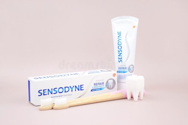 A Box of Sensodyne Toothpaste on a Light Background. Sensodyne is a ...