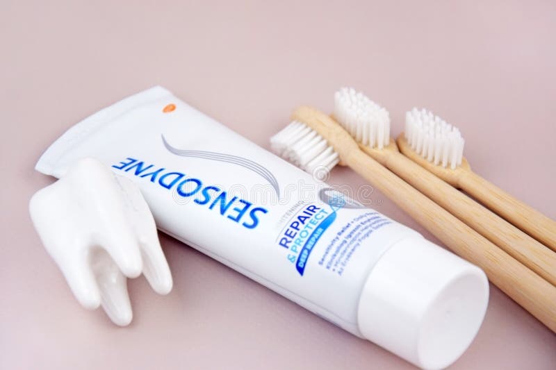 A Box of Sensodyne Toothpaste on a Light Background. Sensodyne is a ...