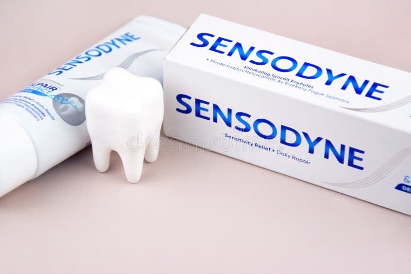 A Box of Sensodyne Toothpaste on a Light Background. Sensodyne is a ...