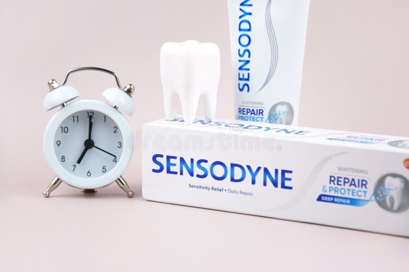 A Box of Sensodyne Toothpaste on a Light Background. Sensodyne is a ...
