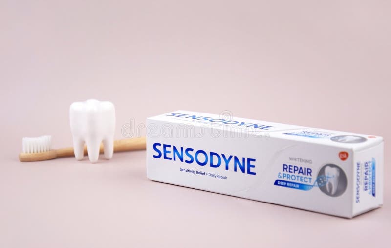 A Box of Sensodyne Toothpaste on a Light Background. Sensodyne is a ...