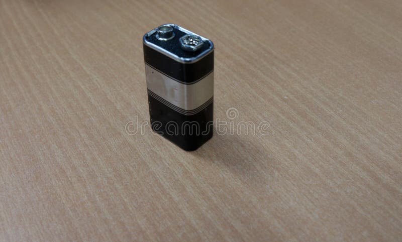 A Box-shaped Battery on the Table Stock Photo - Image of device, font ...