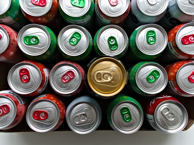 A Box of Soda Cans with a Gold Can in the Middle Stock Image - Image of ...