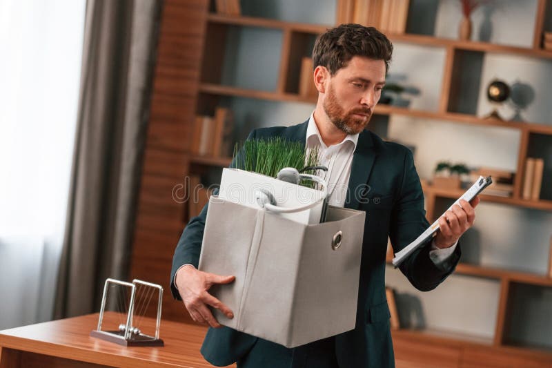 With a Box of Stuff in it. Businessman in Formal Clothes is Working ...