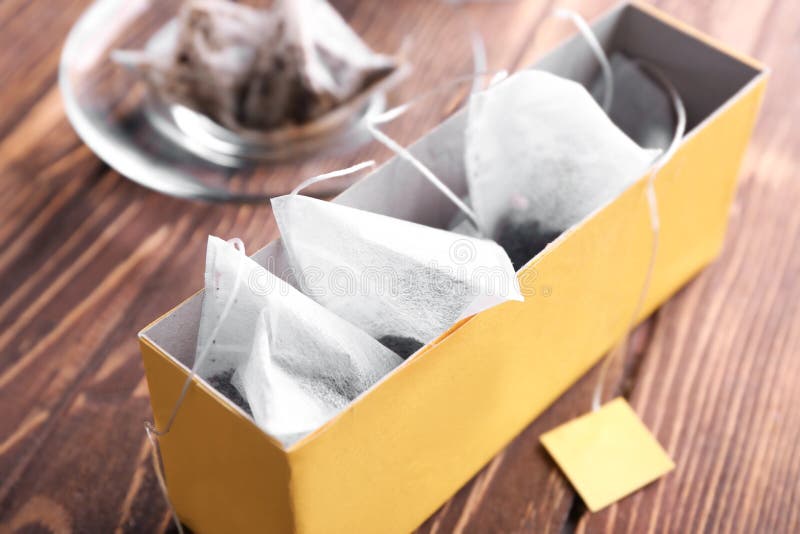 Box with Tea Bags on Wooden Table Stock Photo - Image of flavor ...
