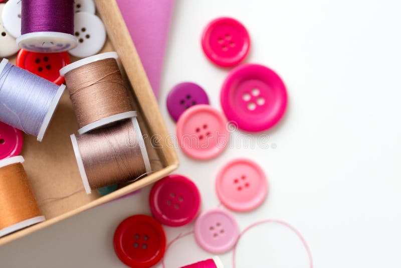 Box with Thread Spools and Sewing Buttons on Table Stock Image - Image ...