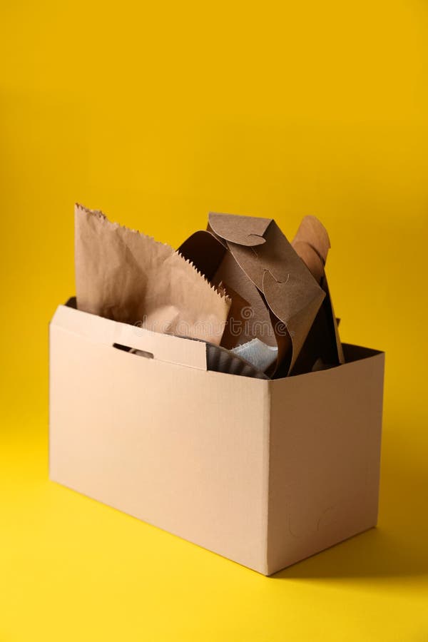 Box with Waste Paper on Yellow Background Stock Image - Image of heap ...