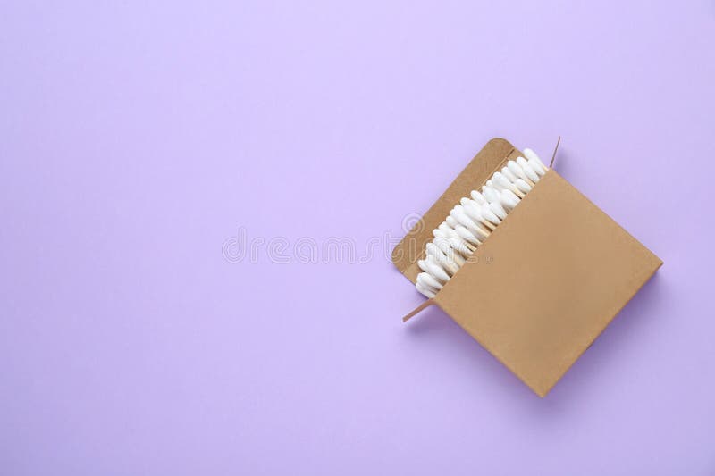 Box with Wooden Cotton Buds on Violet Background, Top View. Space for ...