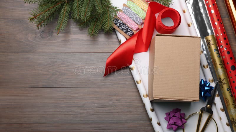 Box, Wrapping Paper and Scissors on Wooden Table, Flat Lay. Space for ...