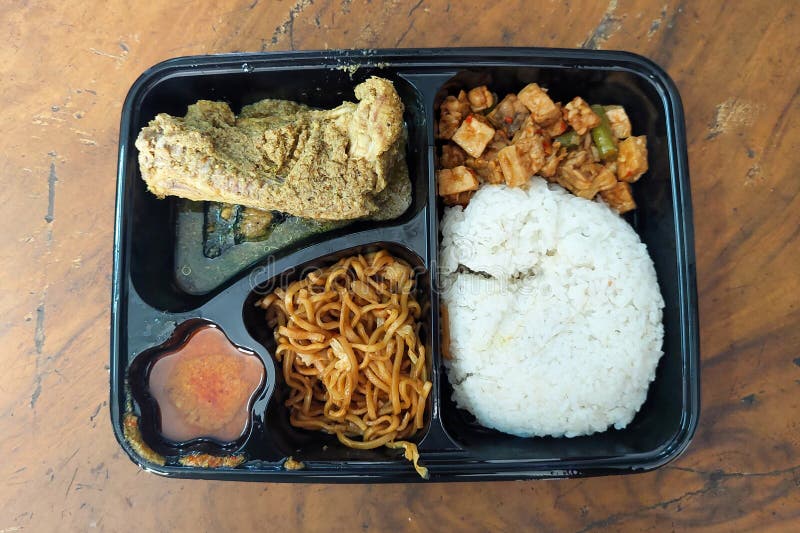 Boxed Rice with Chicken Side Dishes on the Dining Table Stock Photo ...