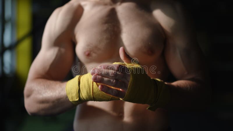 A Boxer is Getting Ready for an Intense Training Session by Wrapping ...