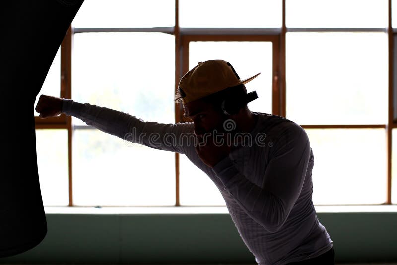 Man Makes Exercises with Punching Bag Stock Photo - Image of people ...